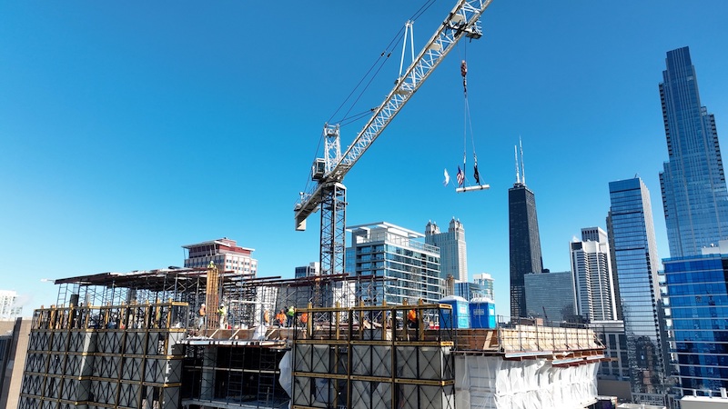 Construction tops out at 741 North Wells, a 21-story mixed-use tower in ...